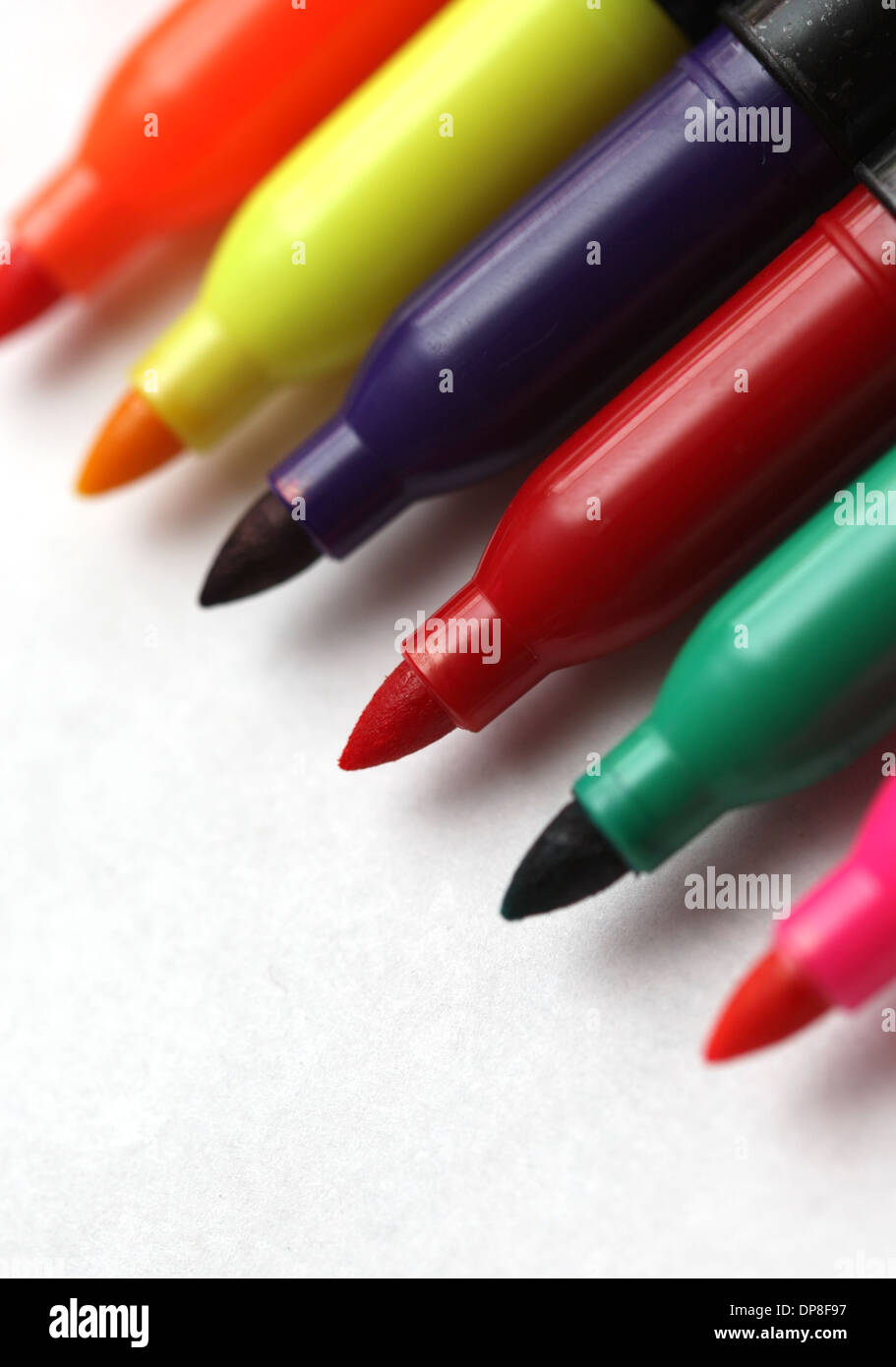 Colored markers on a white background Stock Photo - Alamy