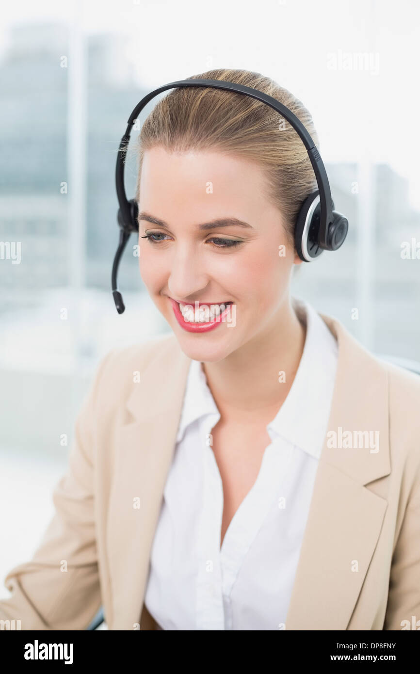 Smiling pretty agent dealing with customer Stock Photo - Alamy