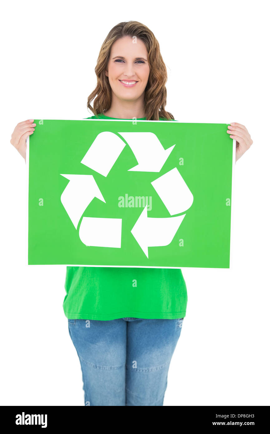 Smiling environmental activist holding recycling sign Stock Photo - Alamy