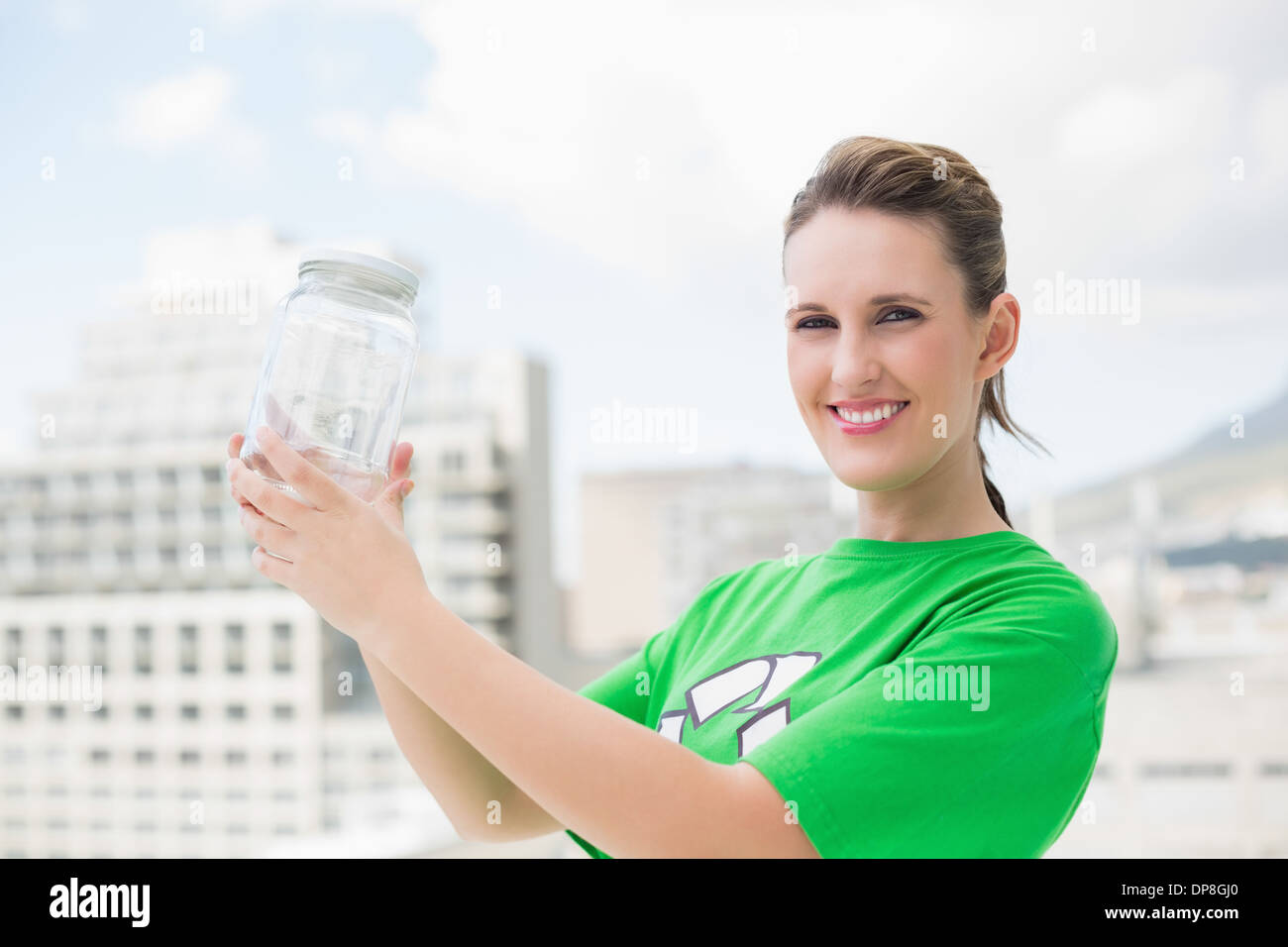 Happy environmental activist holding glass pots Stock Photo - Alamy Happy environmental activist holding glass pots Stock Photo - Alamy