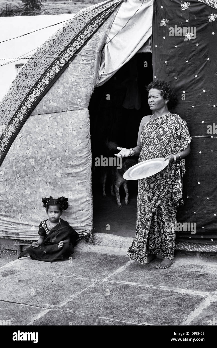 Lower caste Indian woman and child outside their bender / tent ...