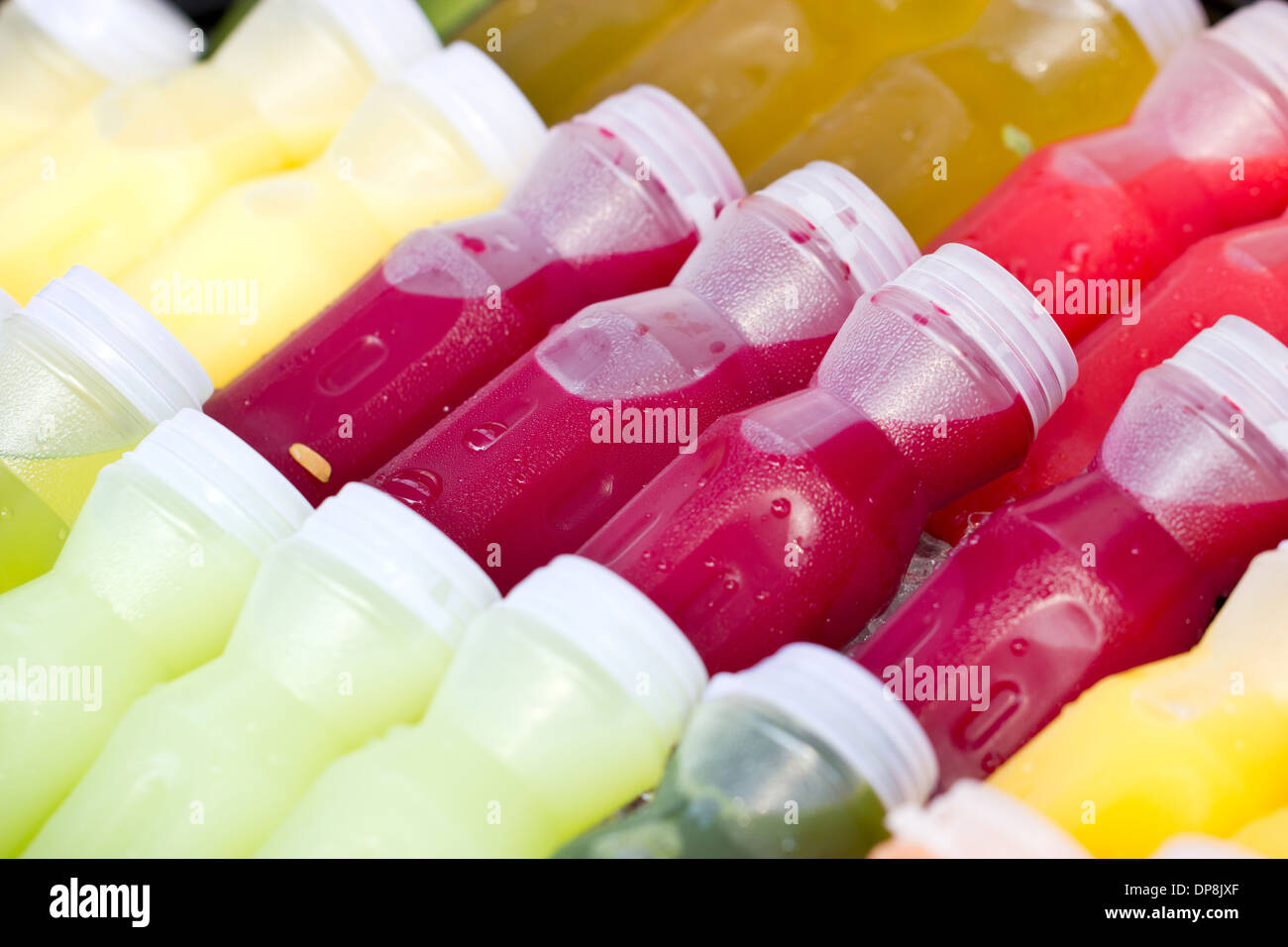 Assortment of Iced tropical fruit juice in bottles Stock Photo - Alamy