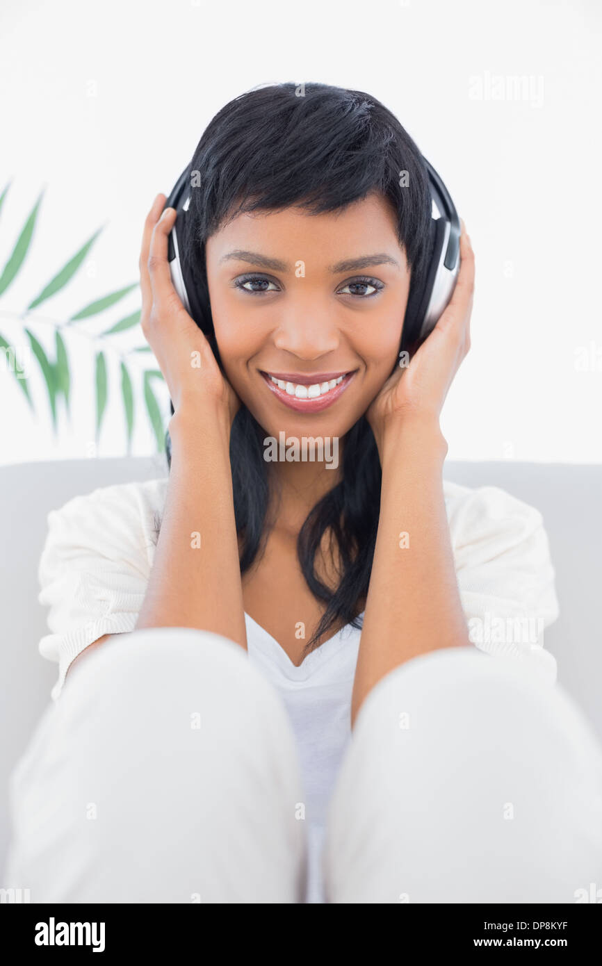 Woman listening music in black hi-res stock photography and images - Alamy