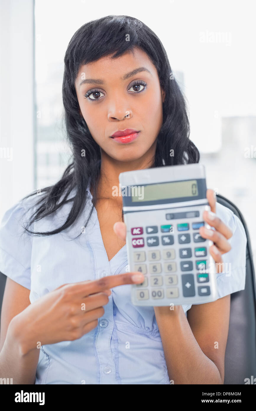 Woman pointing hand calculator hi-res stock photography and images - Alamy