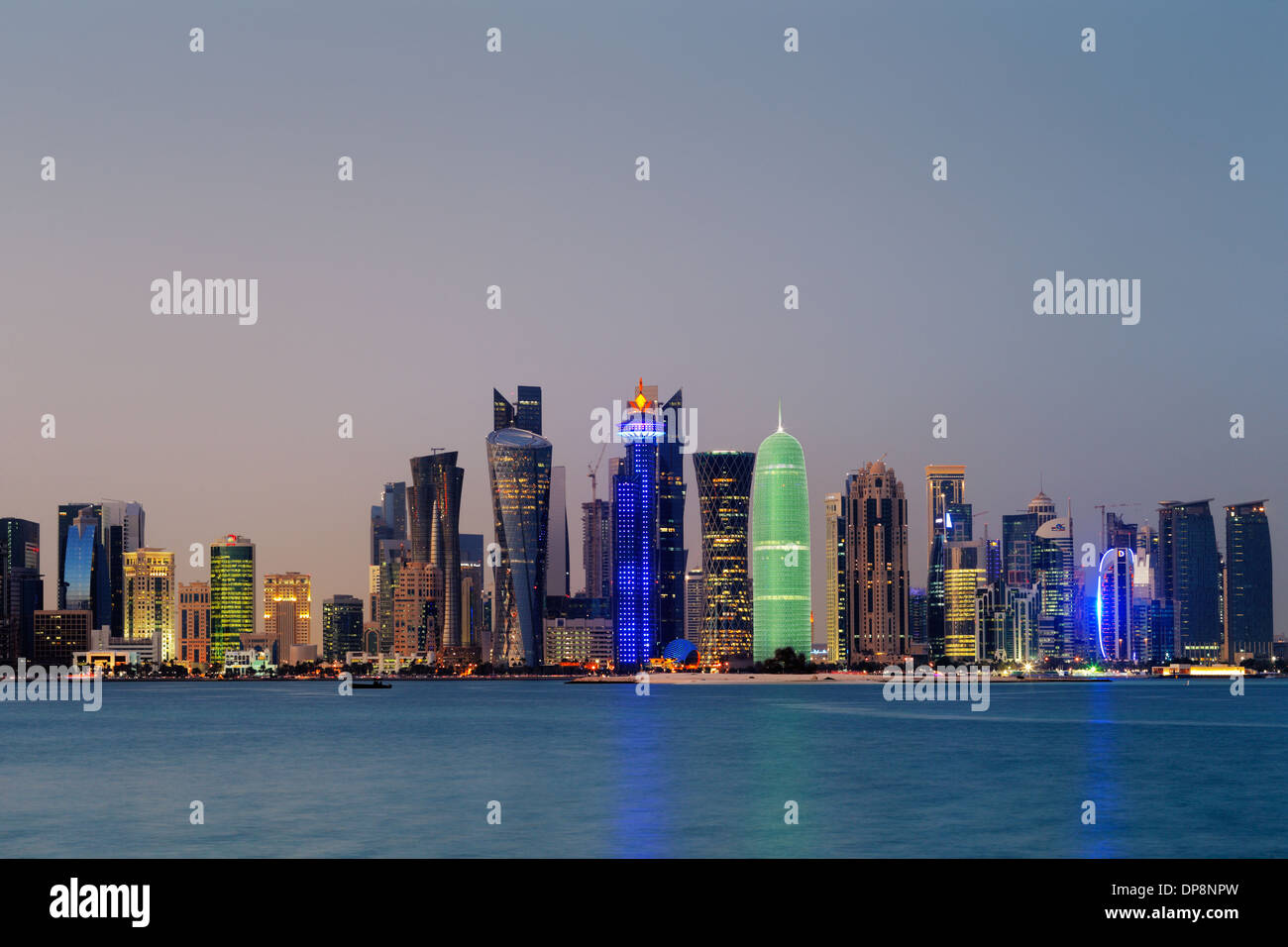 Doha, Qatar at evening is a beautiful city skyline of impressive ...