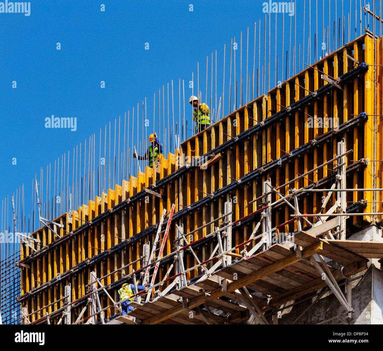 Two builders are preparing the reinforced concrete shuttering Stock ...