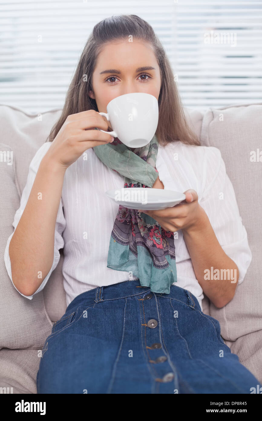 Young pretty model drinking coffee Stock Photo - Alamy