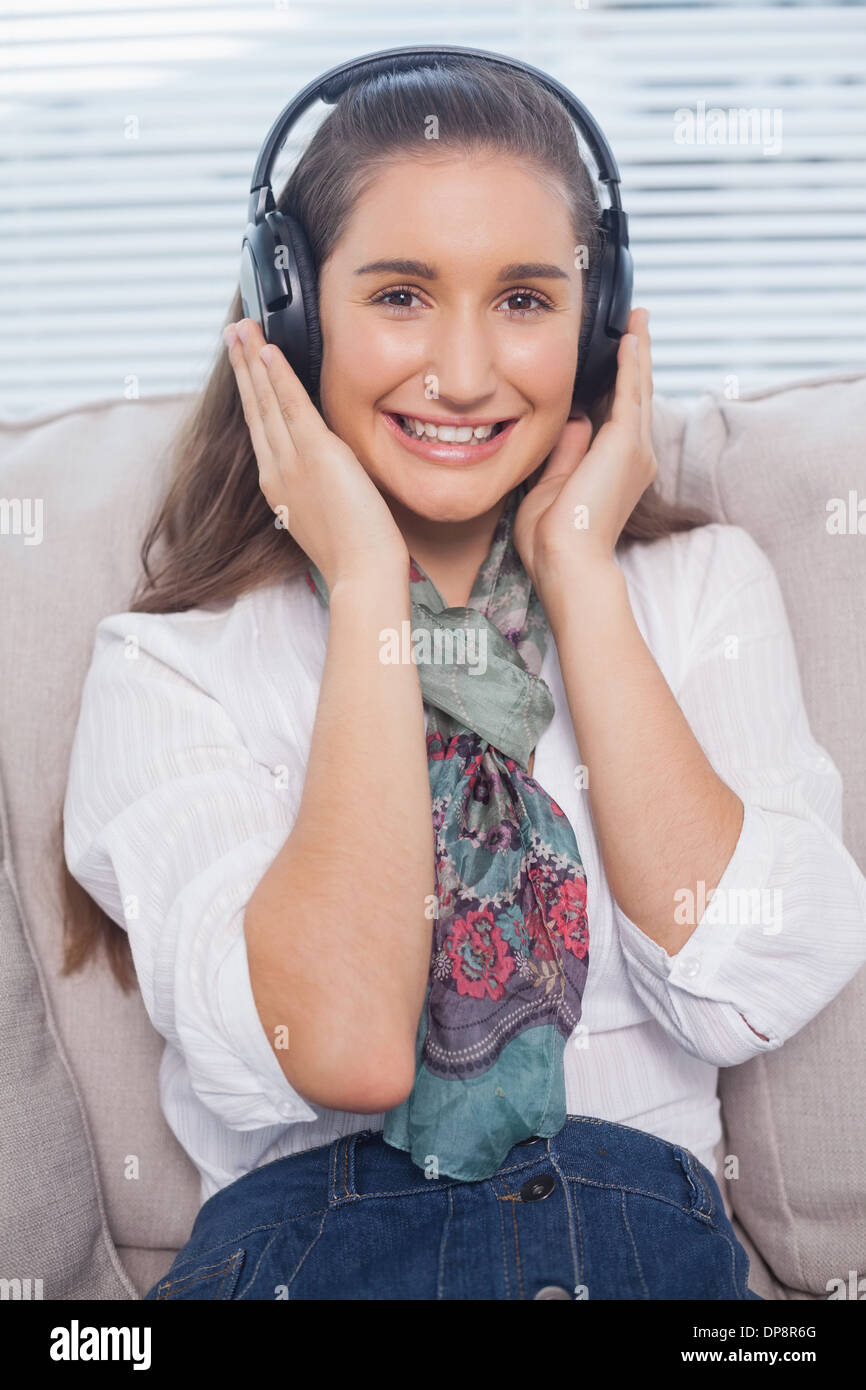 Smiling gorgeous model listening to music Stock Photo - Alamy