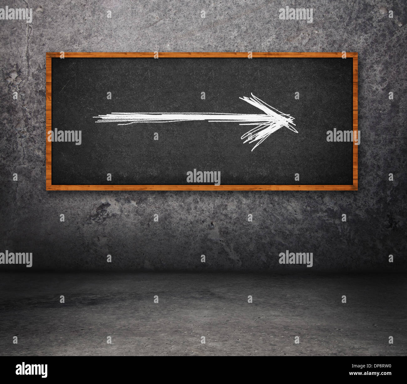 Direction arrow on blackboard in concrete room Stock Photo - Alamy