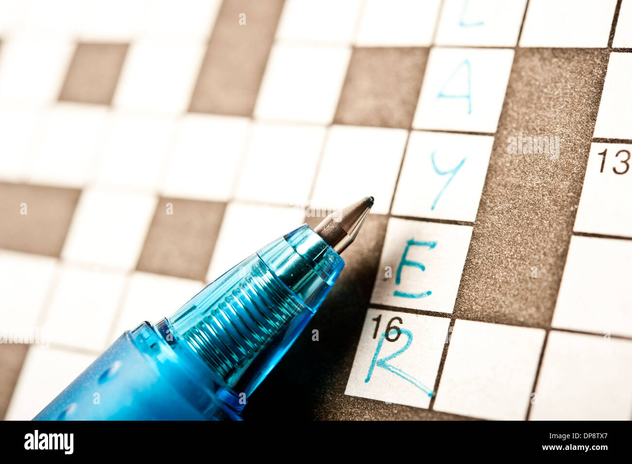 Solving crossword puzzle hi-res stock photography and images - Alamy