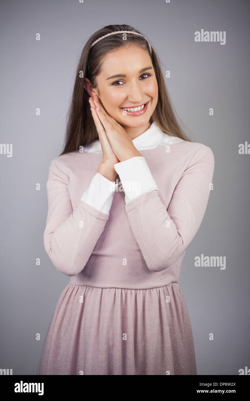Cheerful pretty model with pink dress on posing Stock Photo - Alamy