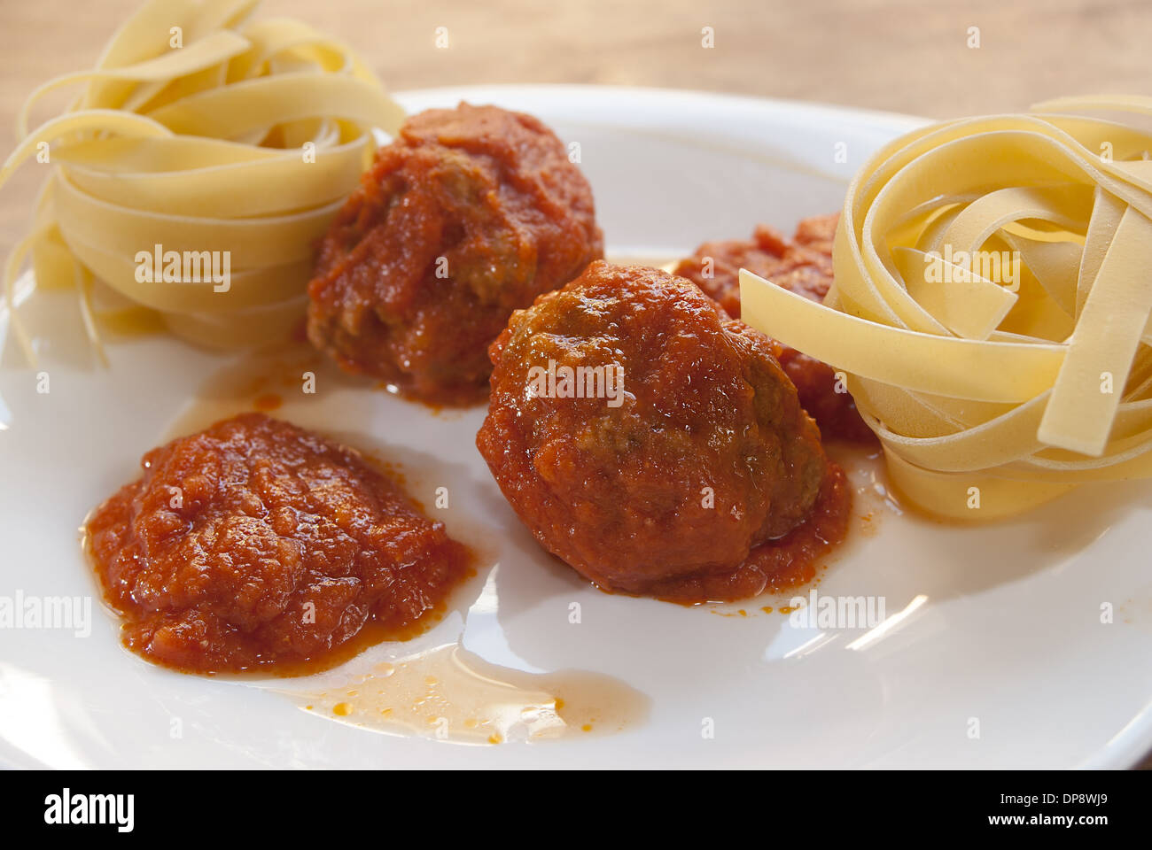 a traditional Italian dish: tagliatelle with sauce meatballs Stock ...