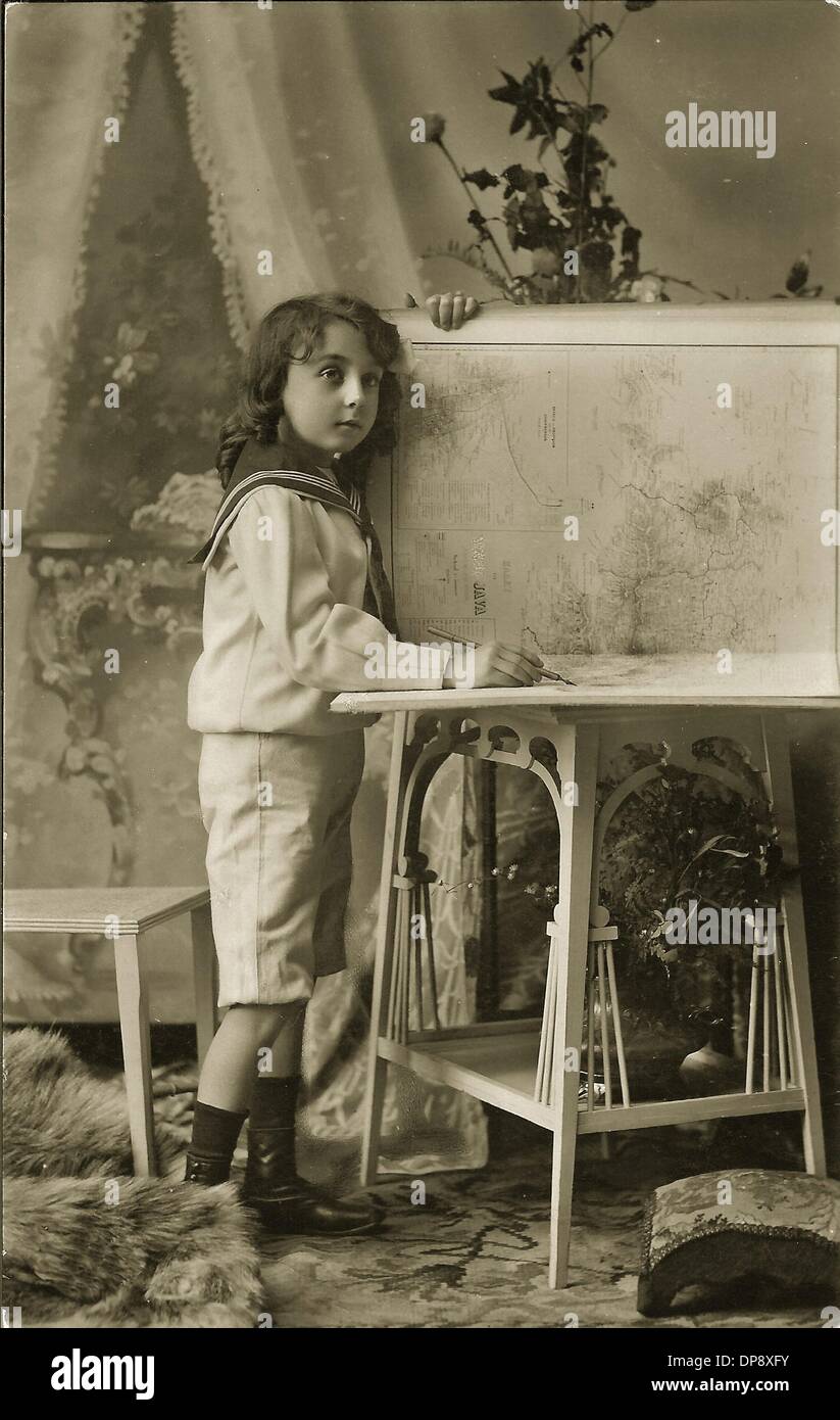 A boy with a map Stock Photo - Alamy