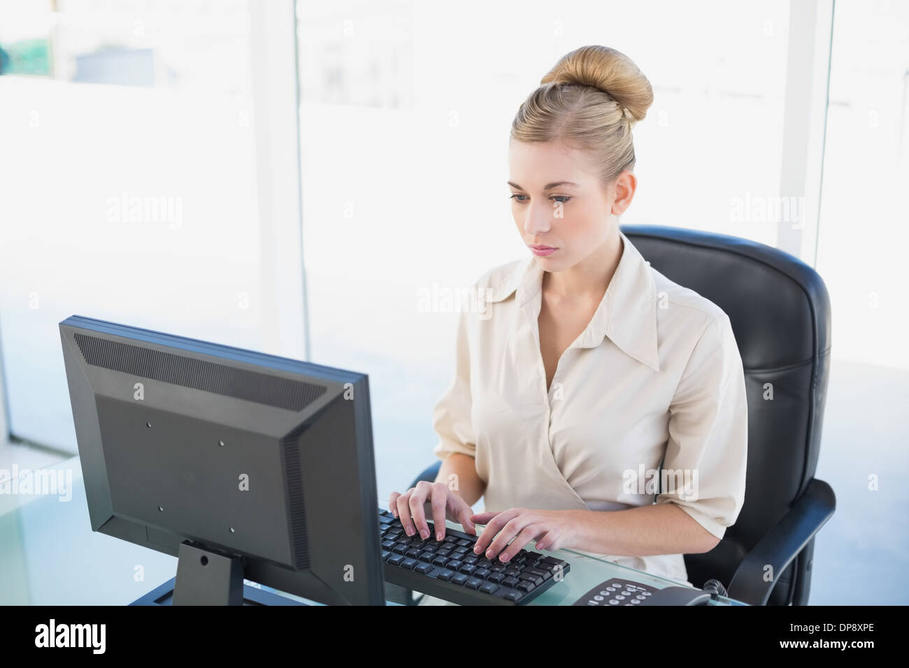 Stern woman and computer hi-res stock photography and images - Alamy