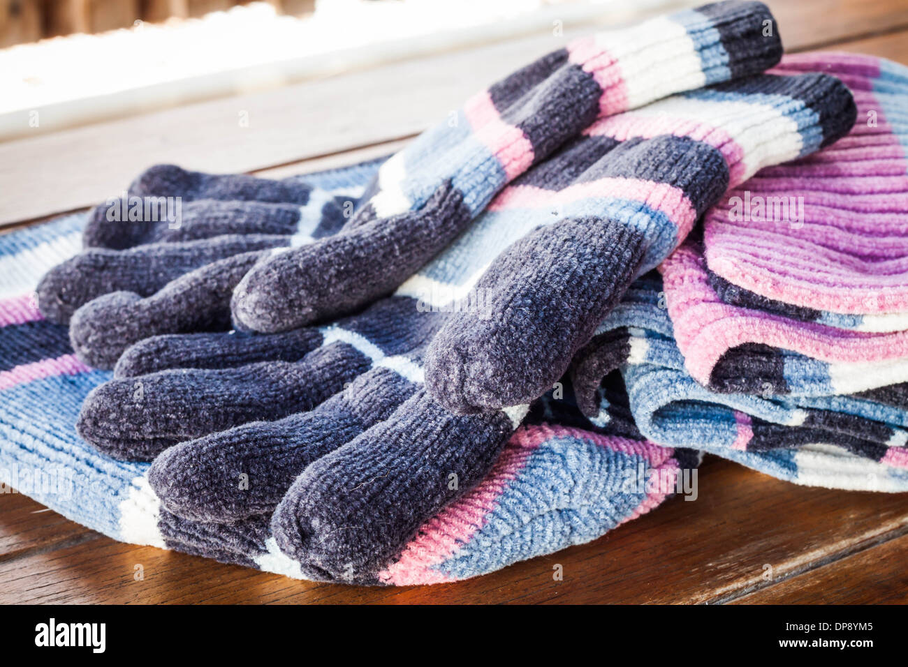 Set of winter wool accessories on wood table Stock Photo - Alamy