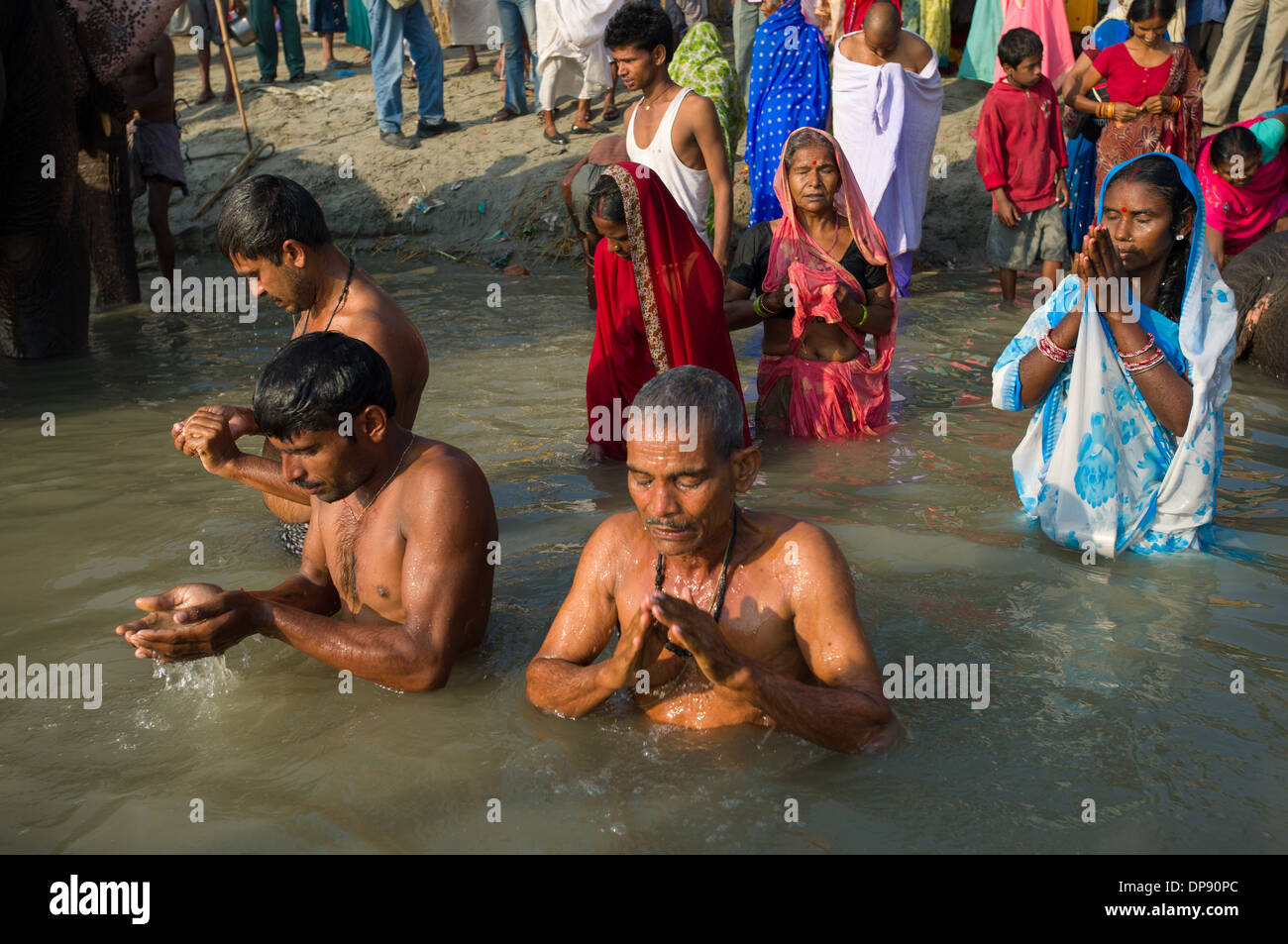 Pilgrims bathing at the confluence of the Rivers Ganges and Gandak ...