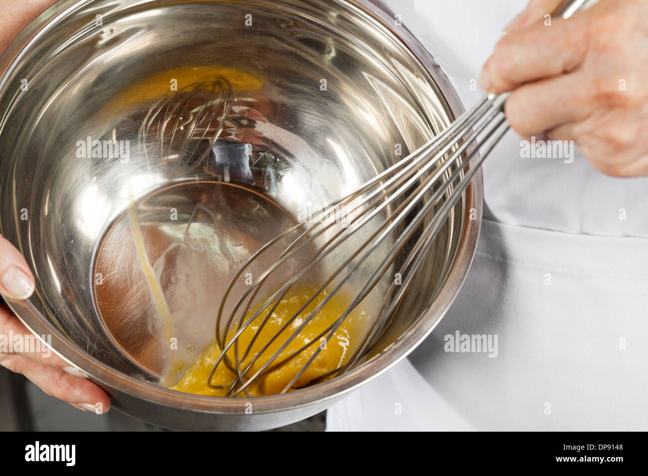 Female Chef Beating Eggs With Wisk Stock Photo - Alamy
