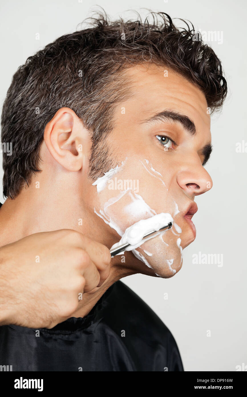 Mature Man Shaving His Face Stock Photo - Alamy