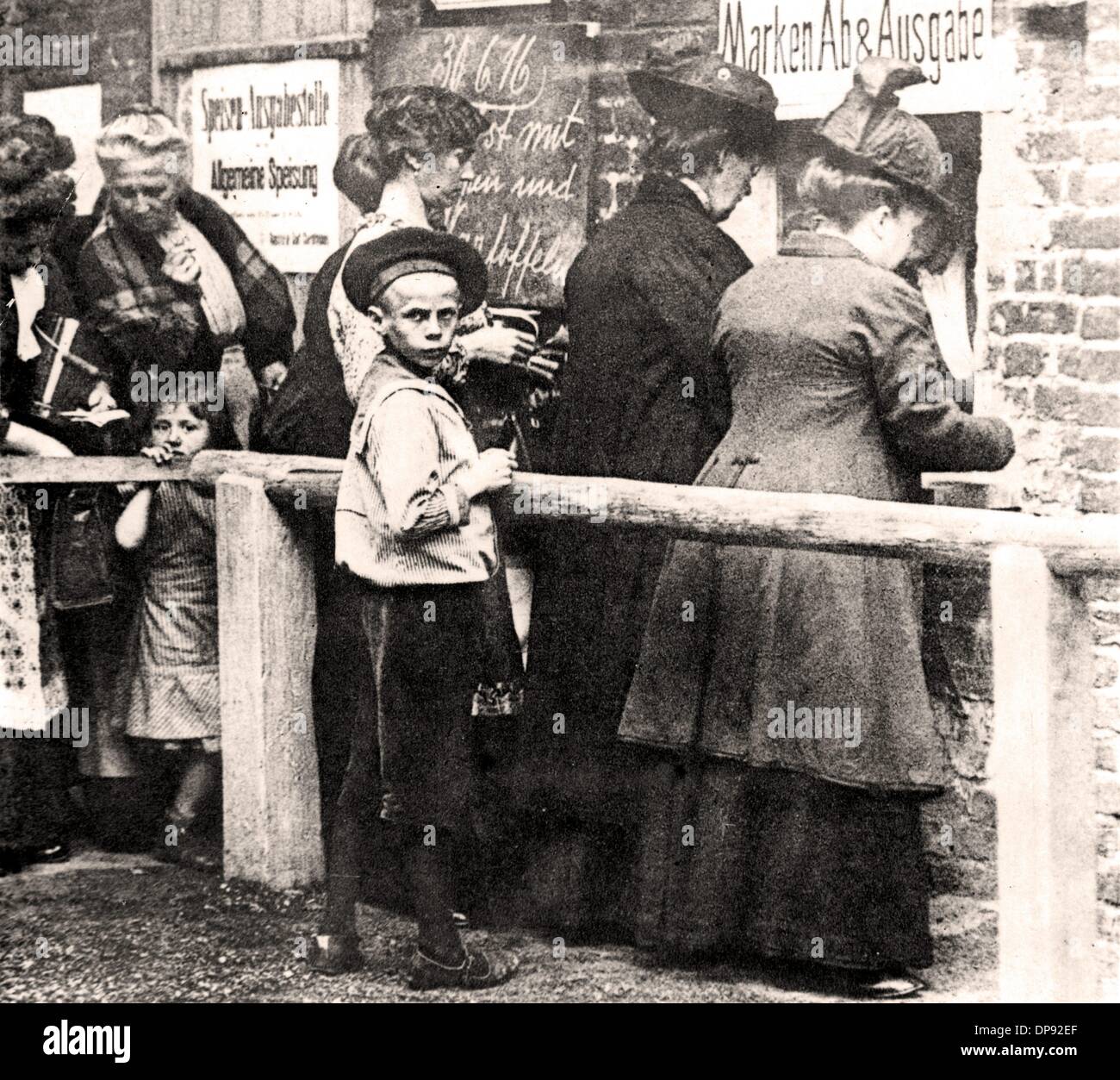 Women and children queue for food in Germany, 30 June 1916. Bread was ...