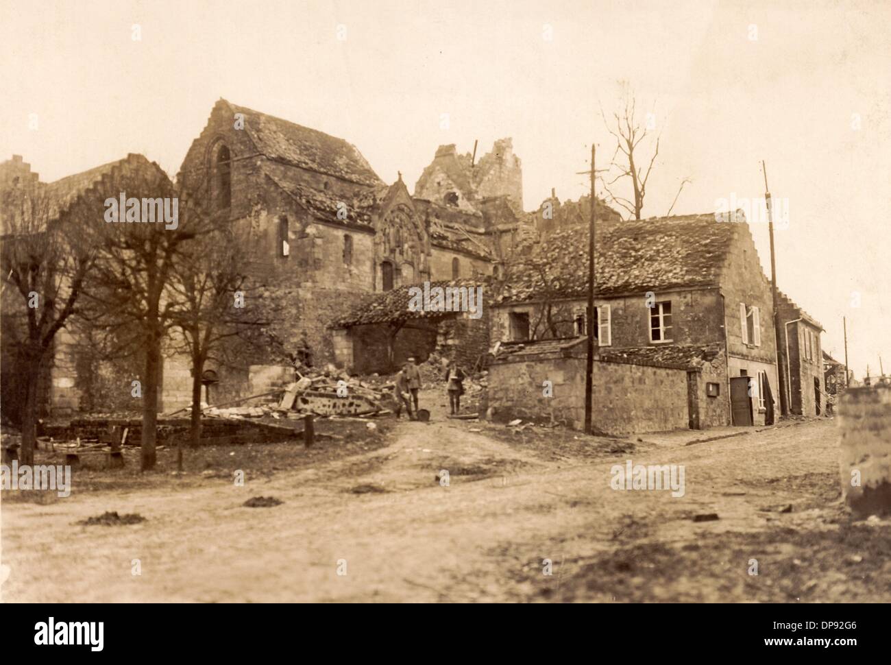 A group of German soldiers is pictured in front of destroyed houses and ...