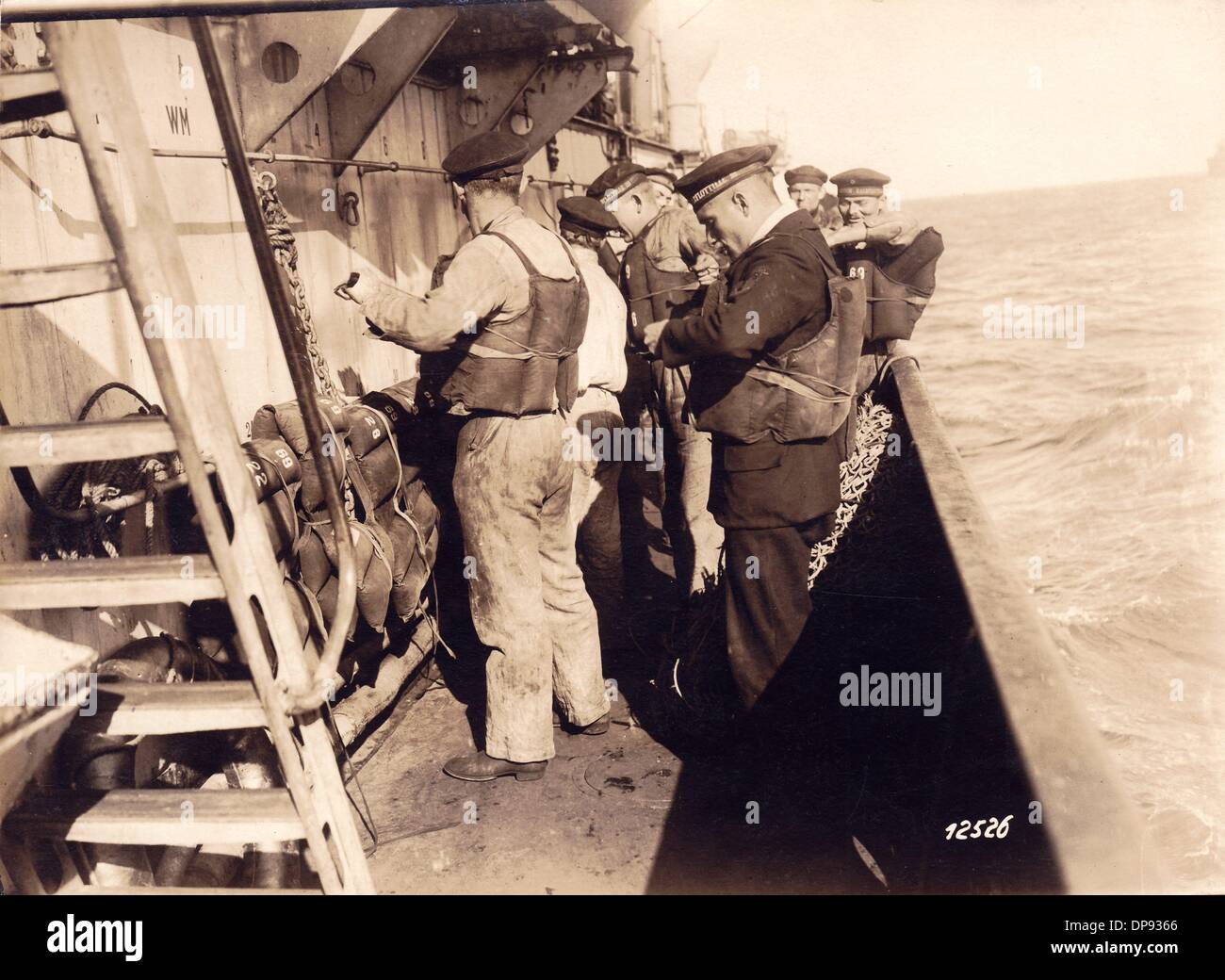 Marines put on life jackets on a minesweeper of the mine sweeper fleet ...