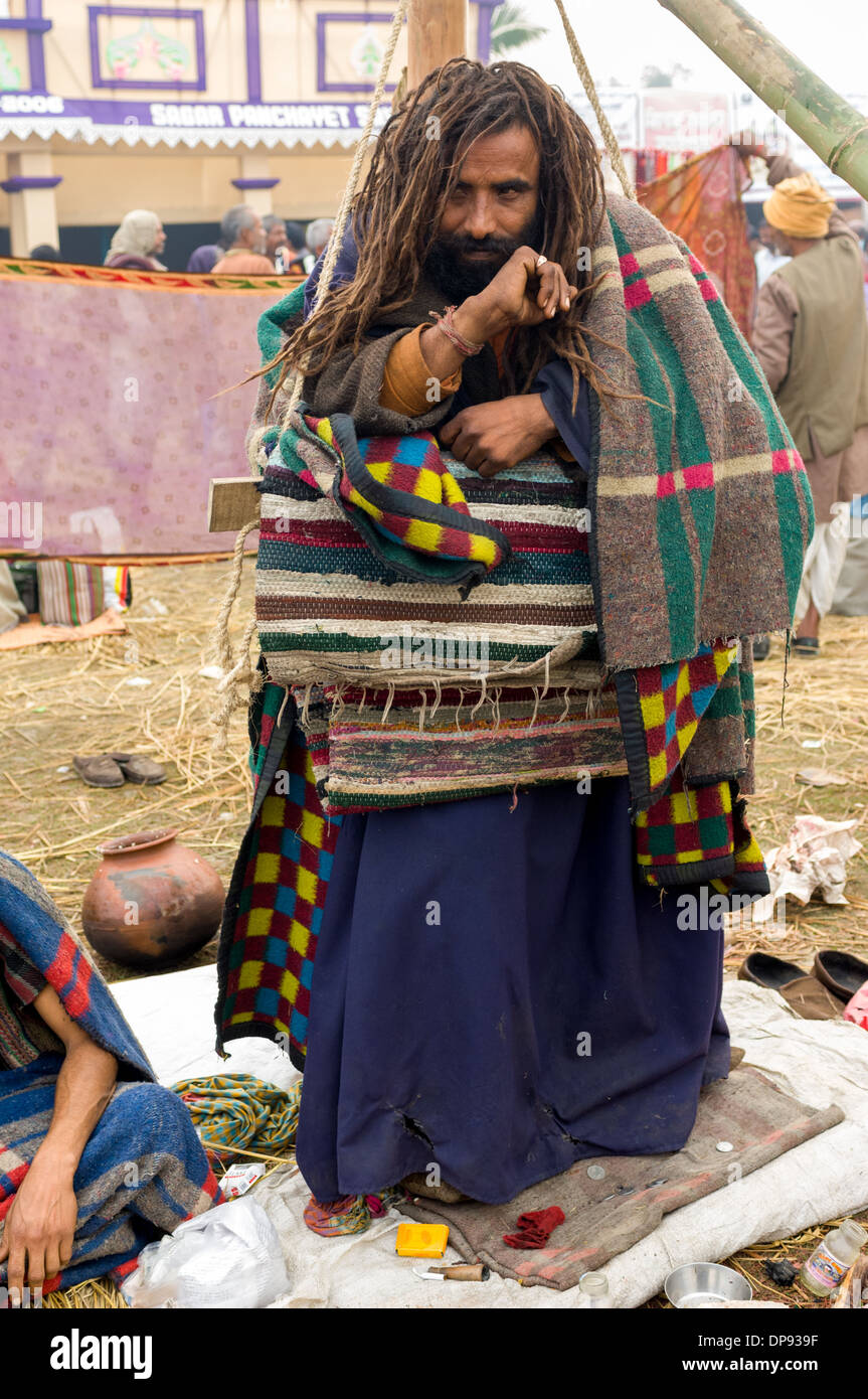 Sadhu (holy man) with dreadlocks carrying out a standing penance at the ...