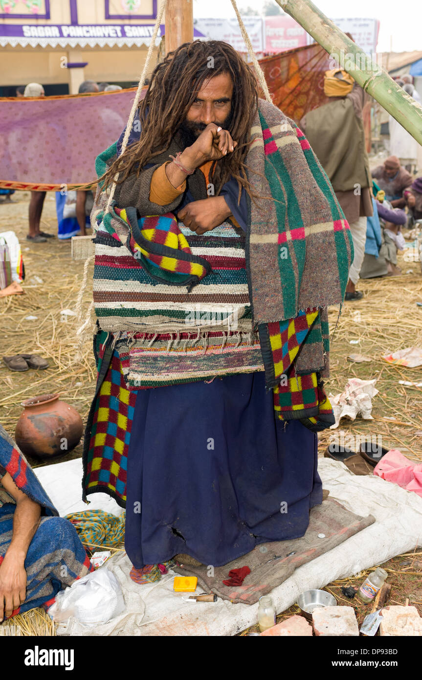 Sadhu (holy man) with dreadlocks carrying out a standing penance at the ...
