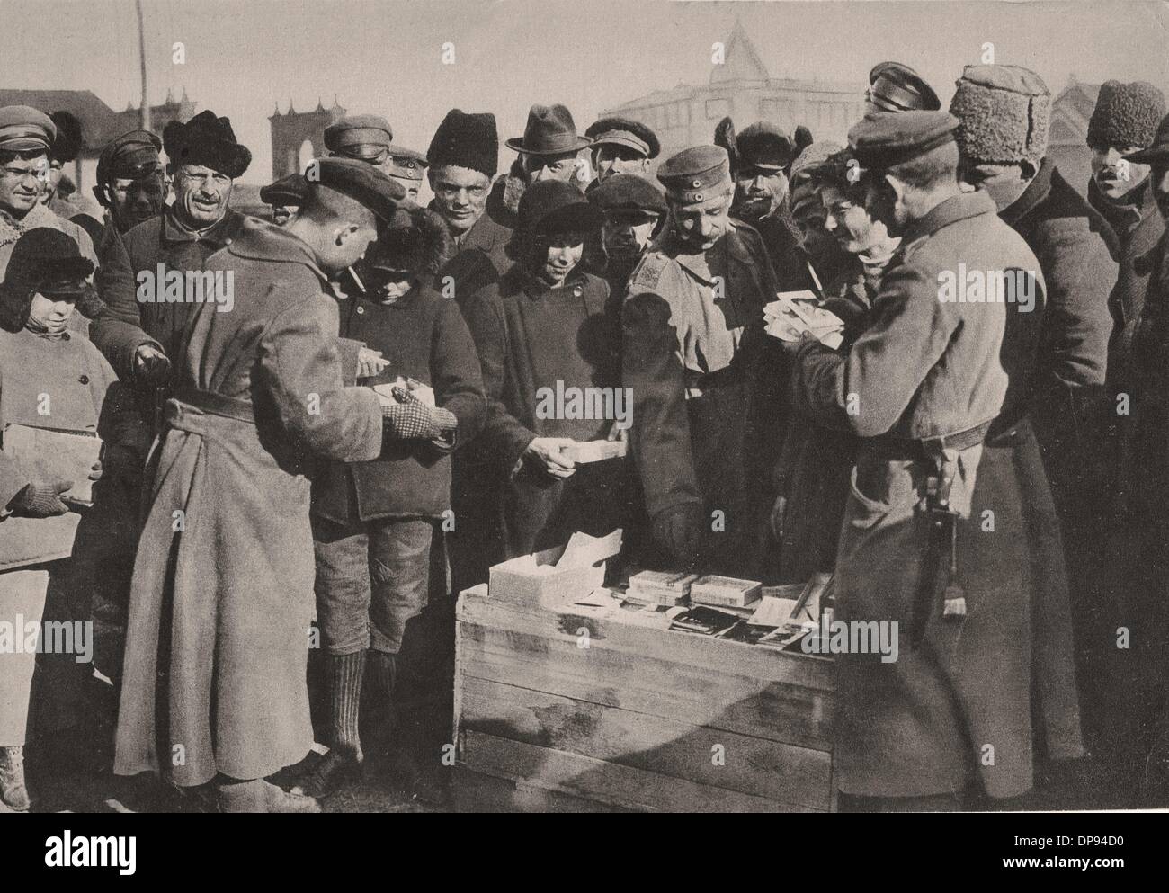 German soldiers and locals trade cigarettes in a city at the Eastern ...