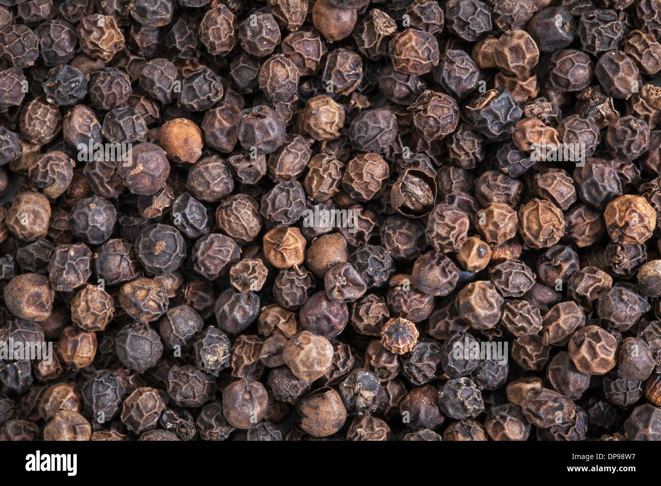 dry black peppercorns background and texture Stock Photo - Alamy