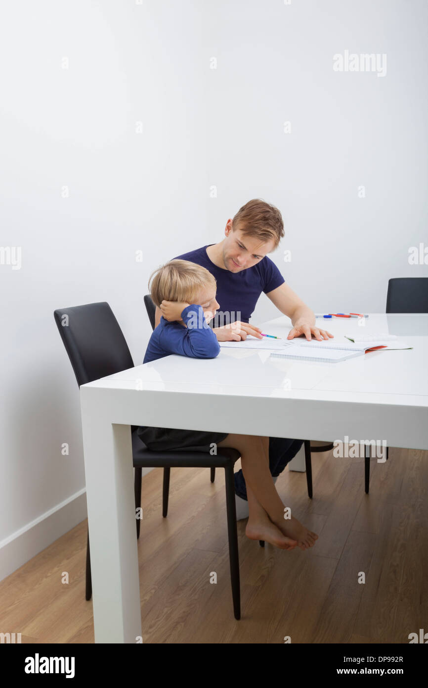 Man helping boy hi-res stock photography and images - Alamy