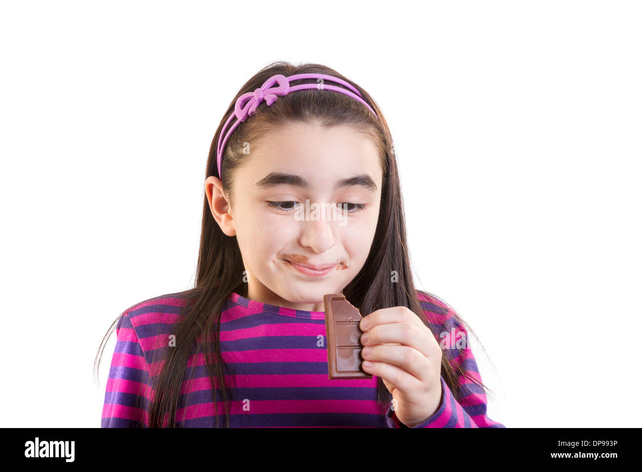 Happy young girl eating chocolate Stock Photo - Alamy