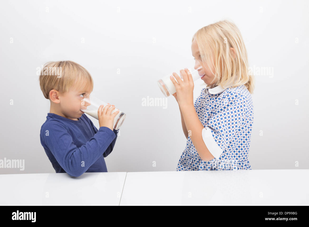 Boy and girl drinking milk hi-res stock photography and images - Alamy