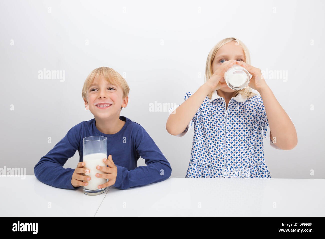 Boy and girl drinking milk hi-res stock photography and images - Alamy