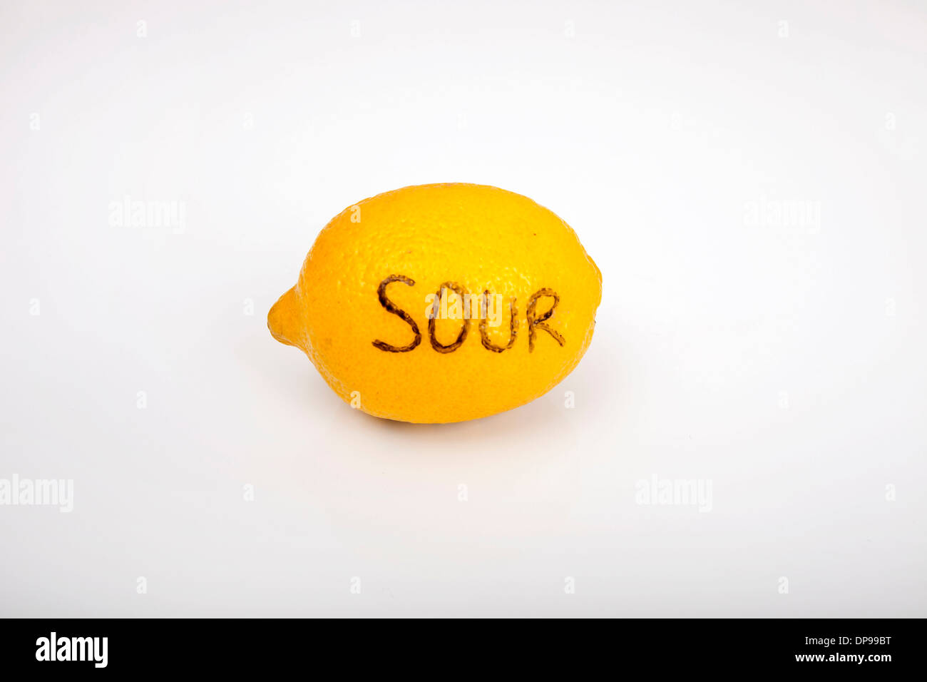 Sour lemon over white background Stock Photo - Alamy