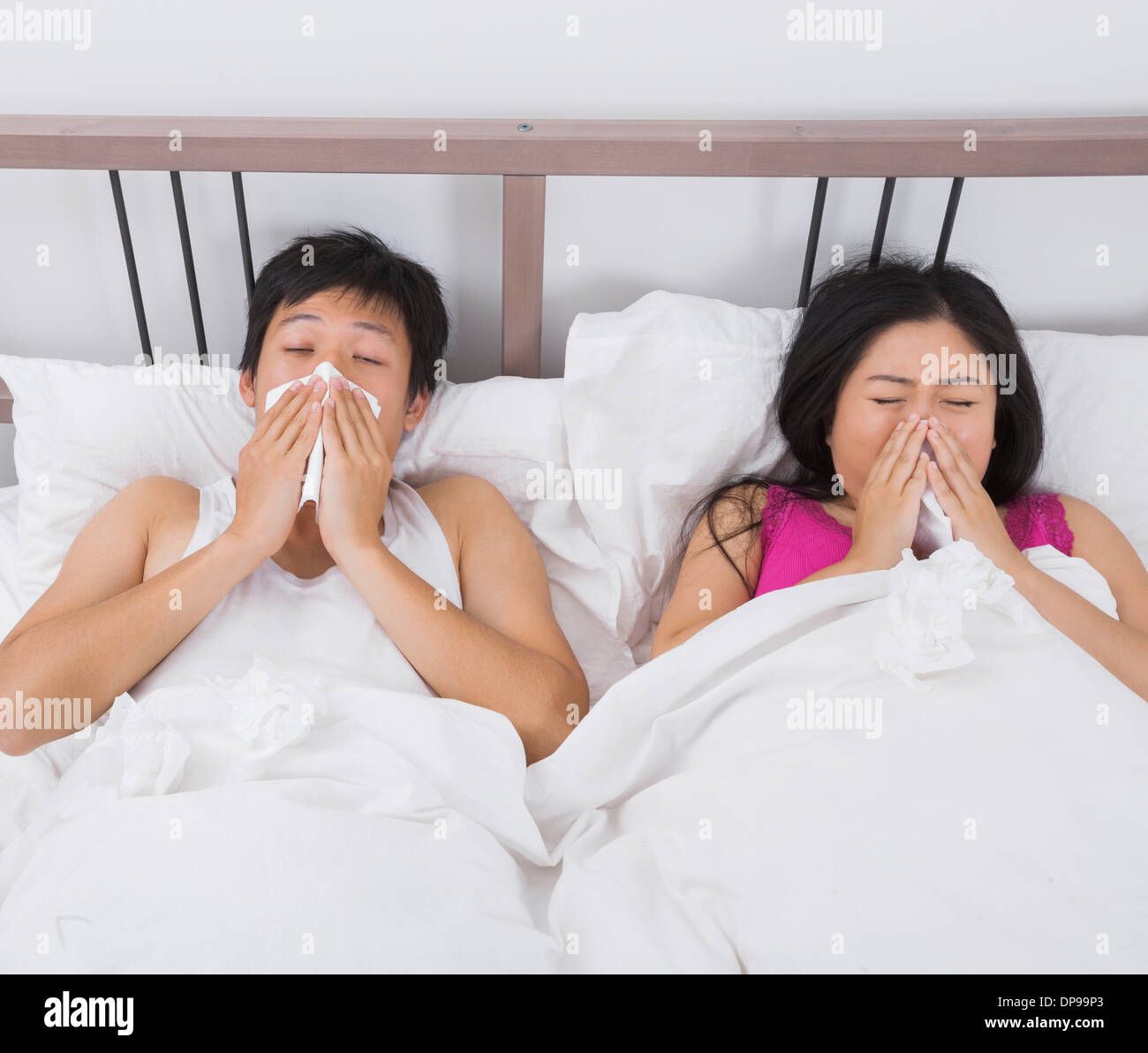 Two young women blowing nose hi-res stock photography and images - Alamy