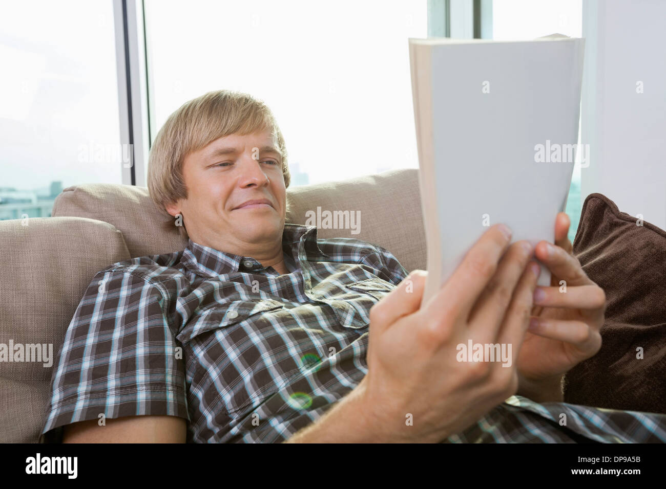 Adult male reading book hi-res stock photography and images - Alamy