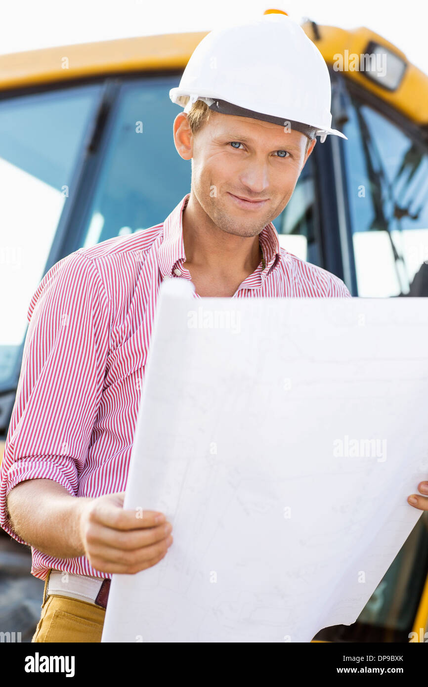Man holding blueprint hi-res stock photography and images - Alamy