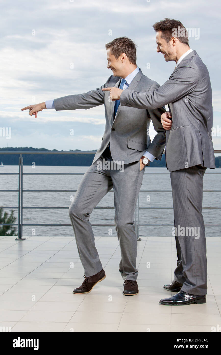 Two men pointing sea hi-res stock photography and images - Alamy