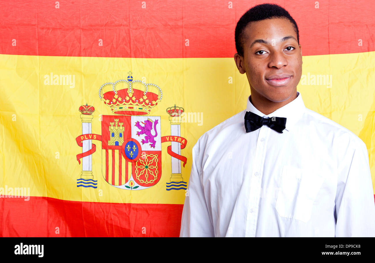 Close-up portrait of young man against Spanish flag Stock Photo - Alamy