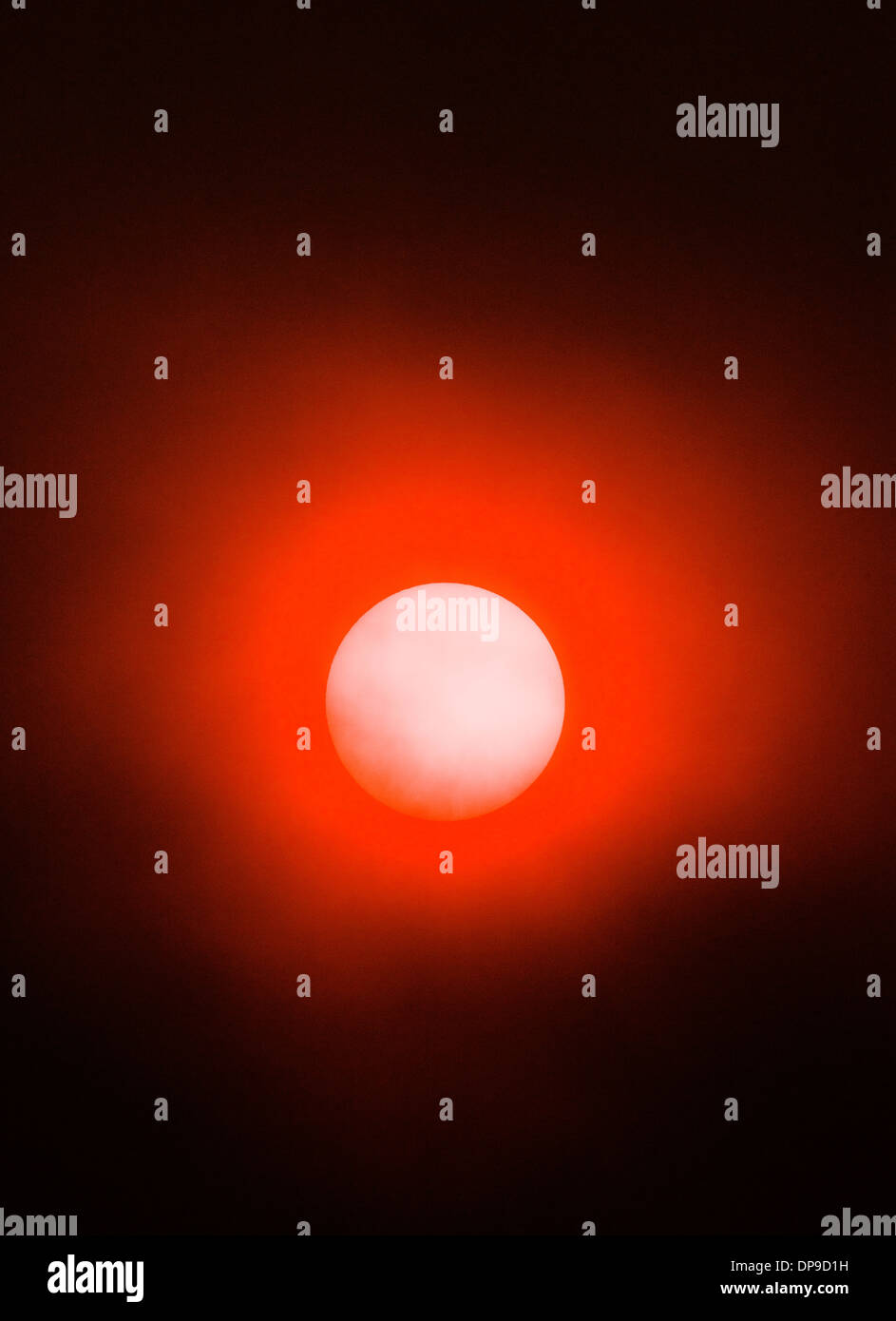 Smoke from forest fires creates an unusual eerie orange glow to the ...