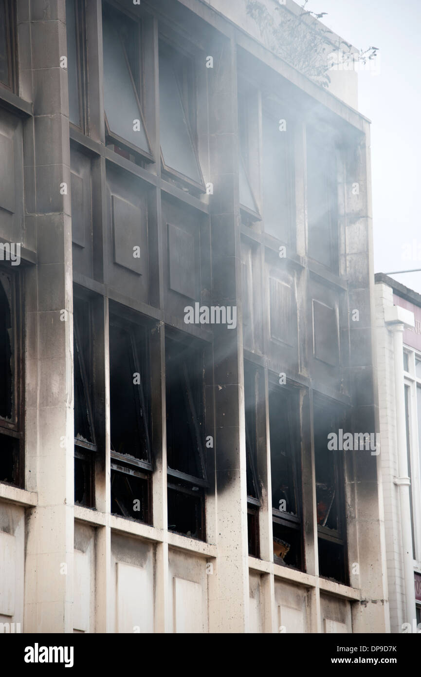 Smoke coming from windows of office block fire Stock Photo - Alamy