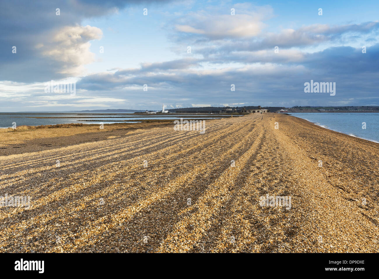 Evening sunlight on the long shingle spit leading to Hurst Castle and ...