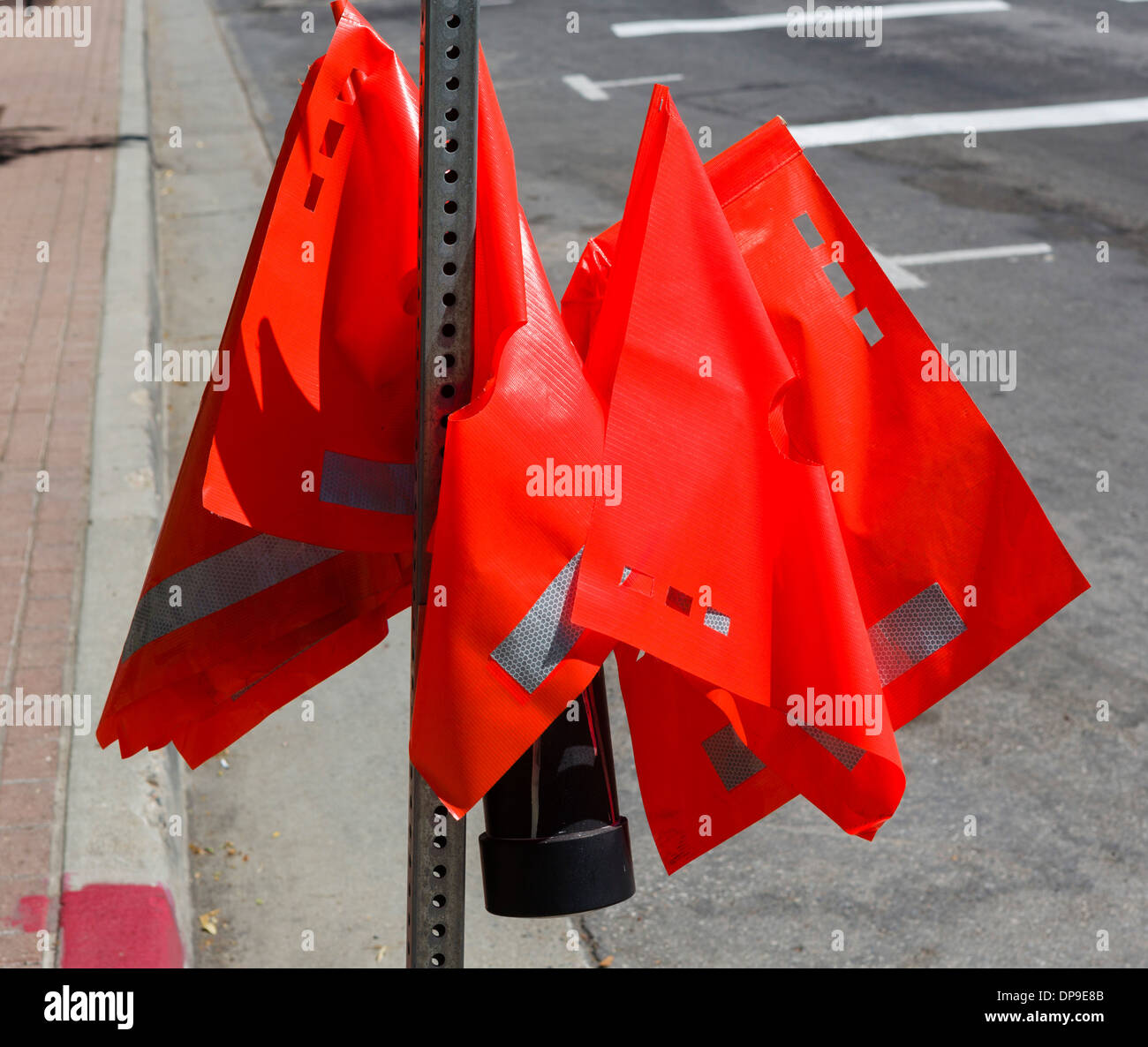 Flags for use by pedestrians crossing street in downtown Salt Lake City ...