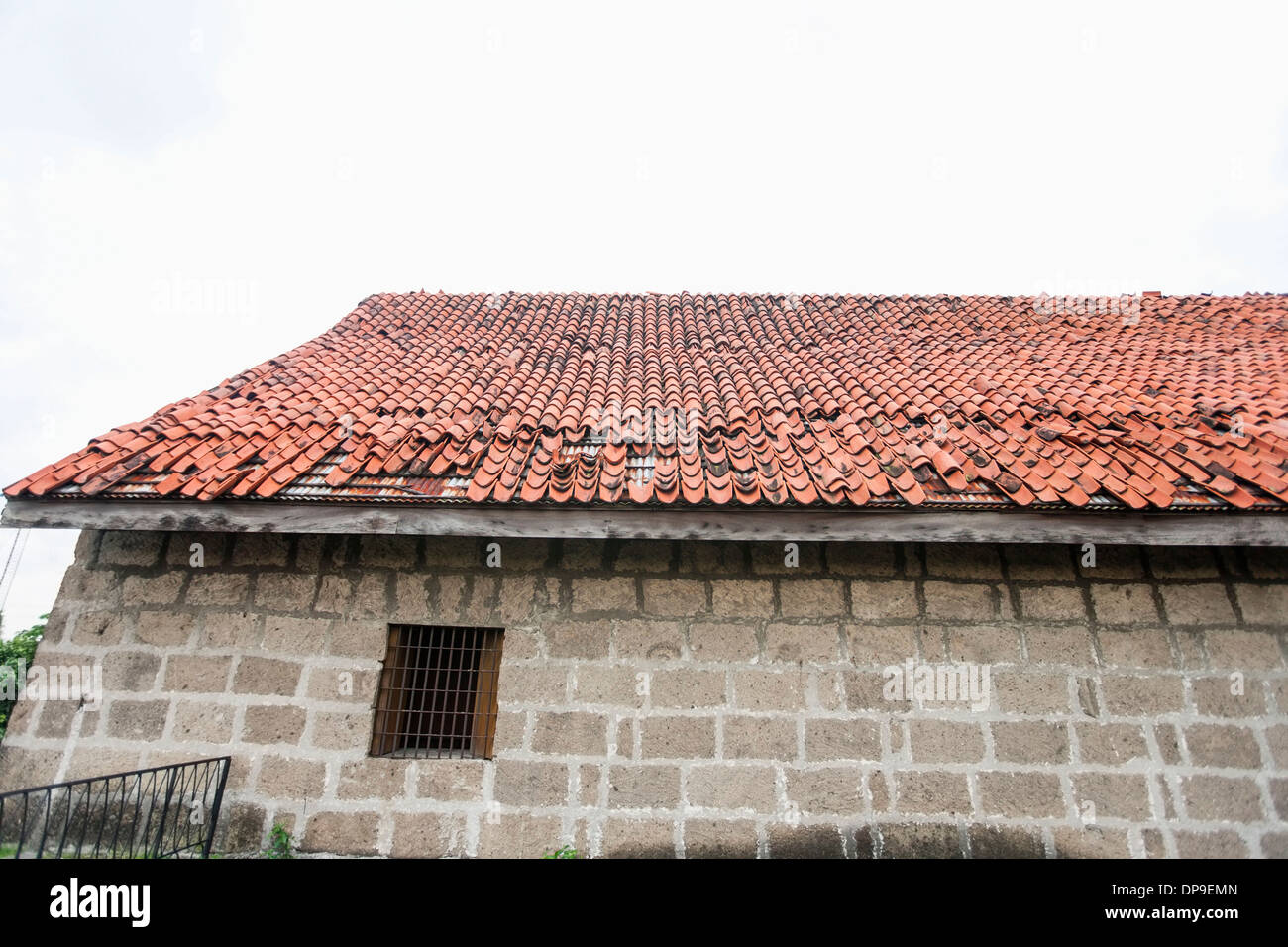 House with tiled roof and stone wall in Manila Philippines Stock Photo ...