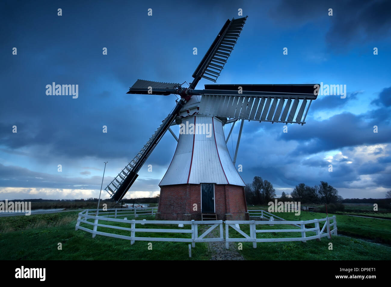 Dutch windmill over storm sky, Holland Stock Photo - Alamy