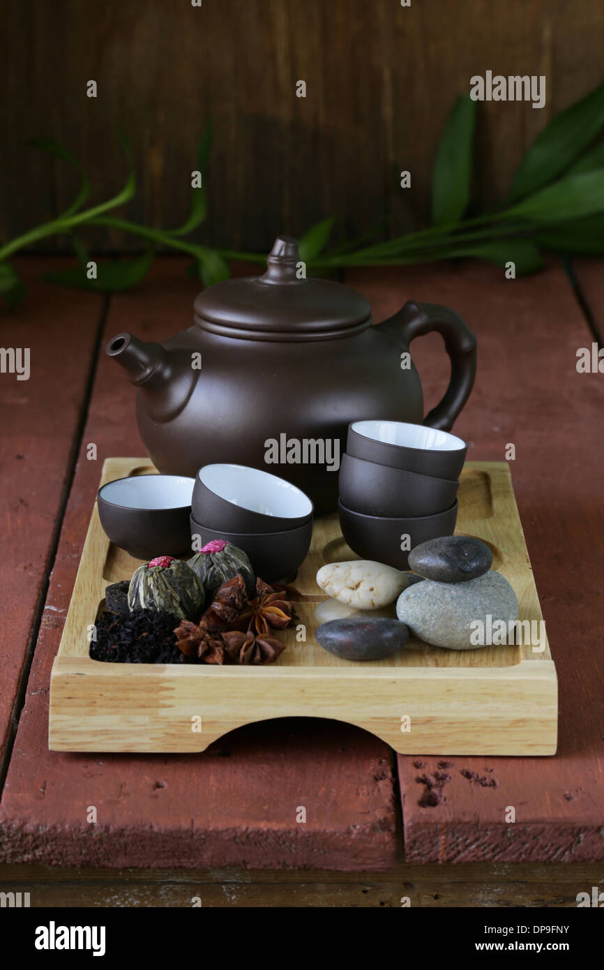 set for a traditional tea drinking (kettle, cups and various grain tea ...