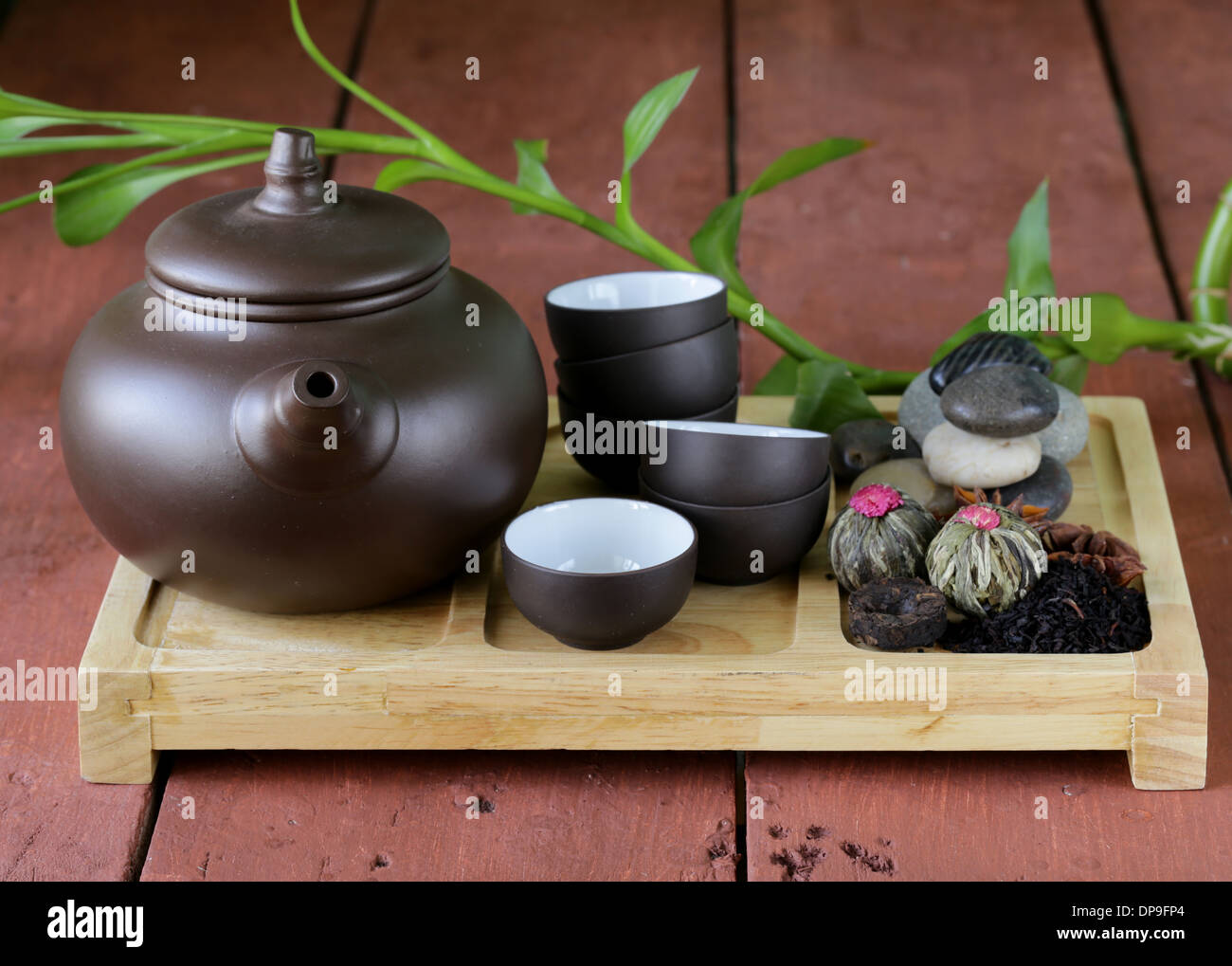 set for a traditional tea drinking (kettle, cups and various grain tea ...