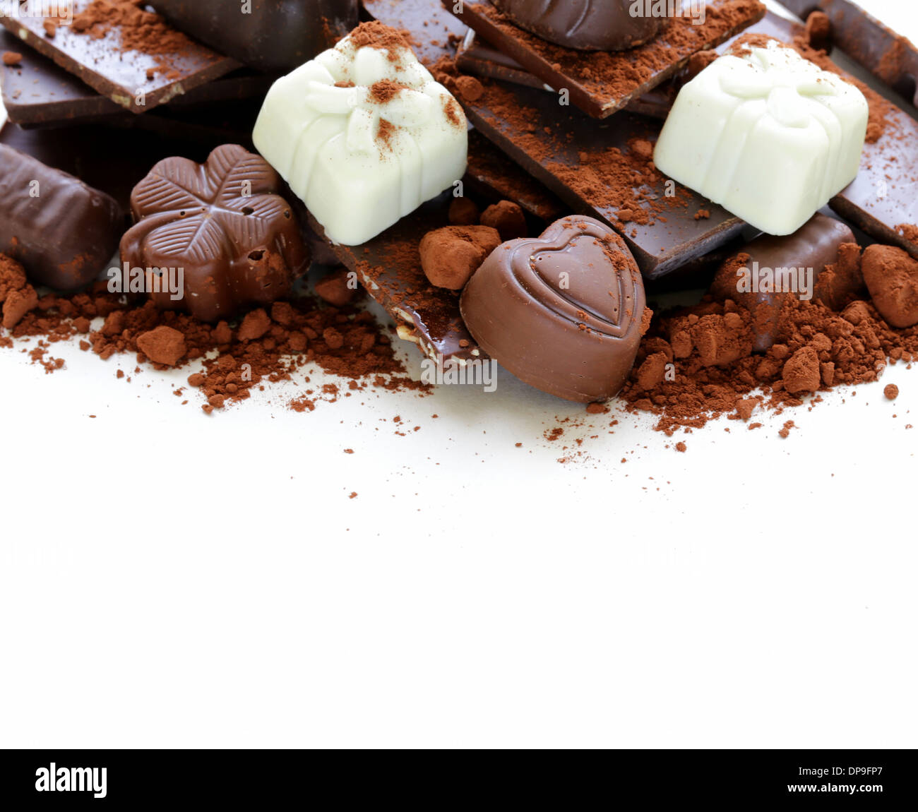 different varieties of chocolate and sweets on a white background Stock ...