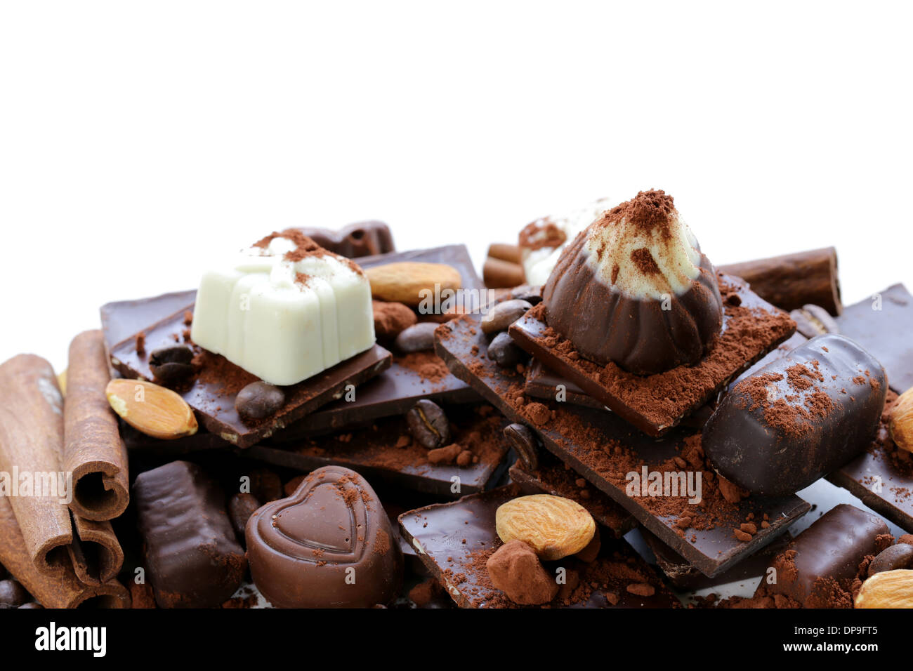 different varieties of chocolate and sweets on a white background Stock ...
