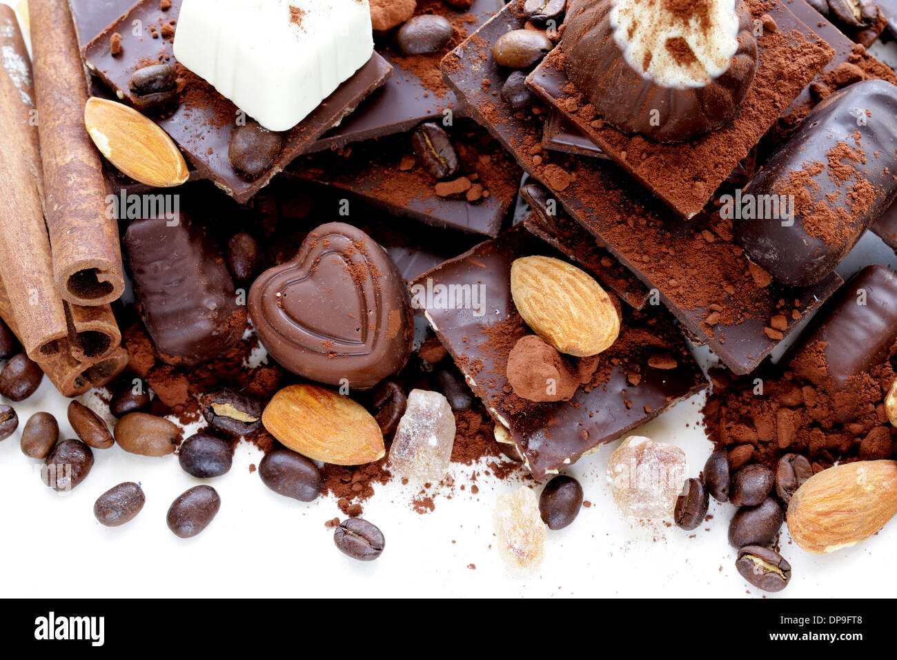 different varieties of chocolate and sweets on a white background Stock ...